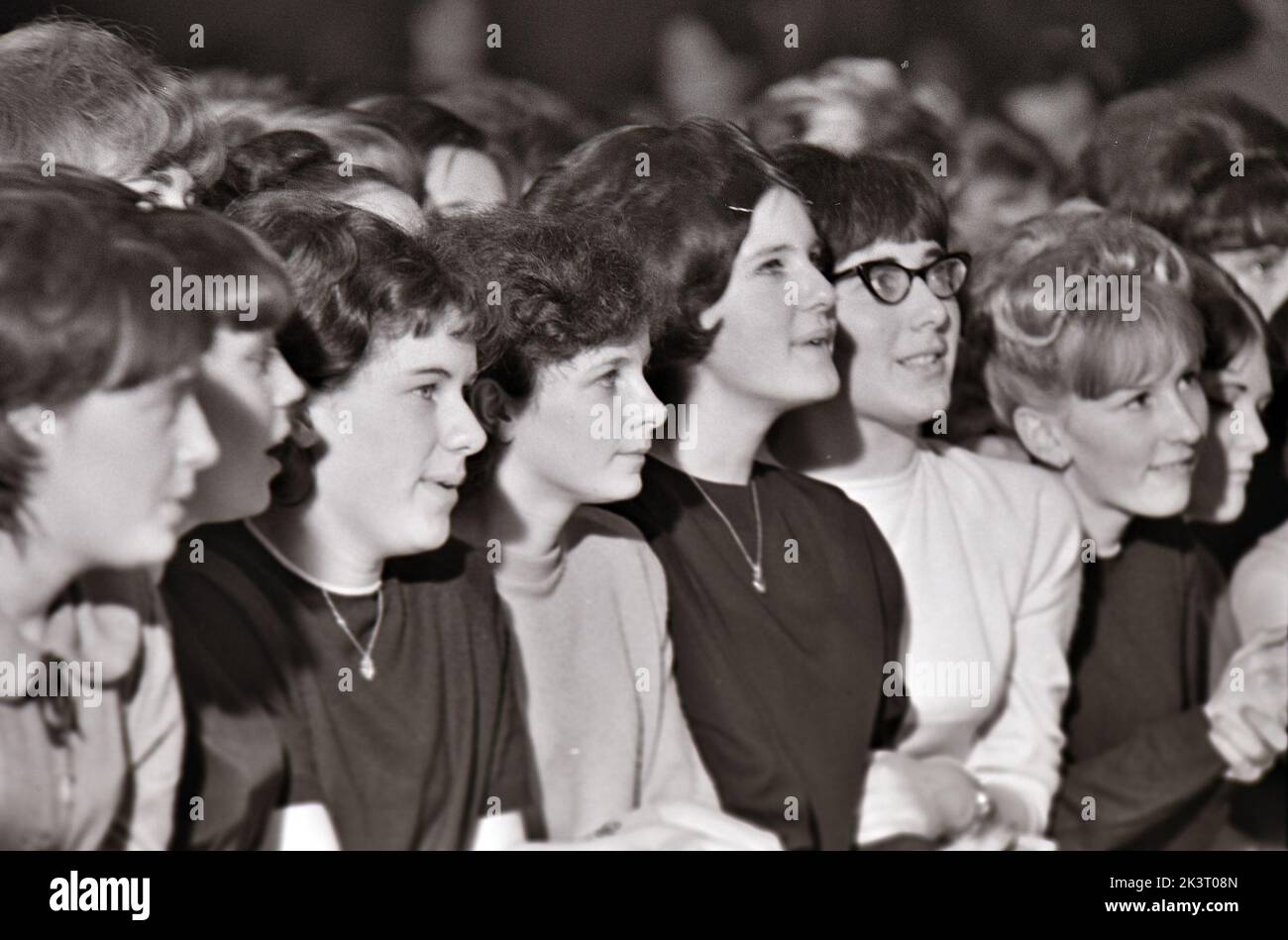 TEENAGERS at the Royal, Tottenham, London, in January 1964 watching the ...