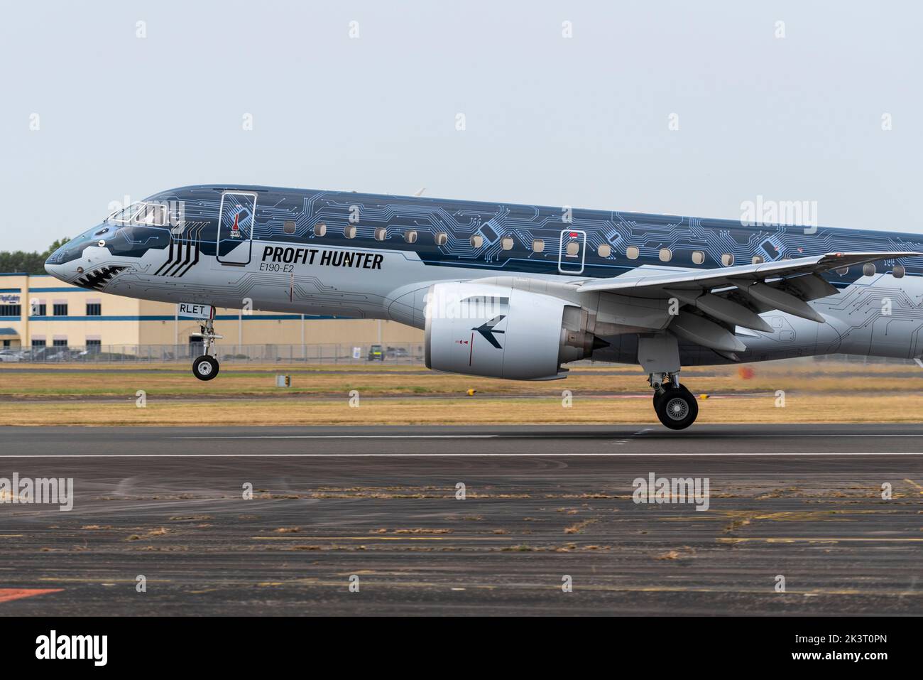 Embraer E190-E2 jet airliner plane named 'Profit Hunter' landing after display at Farnborough ...
