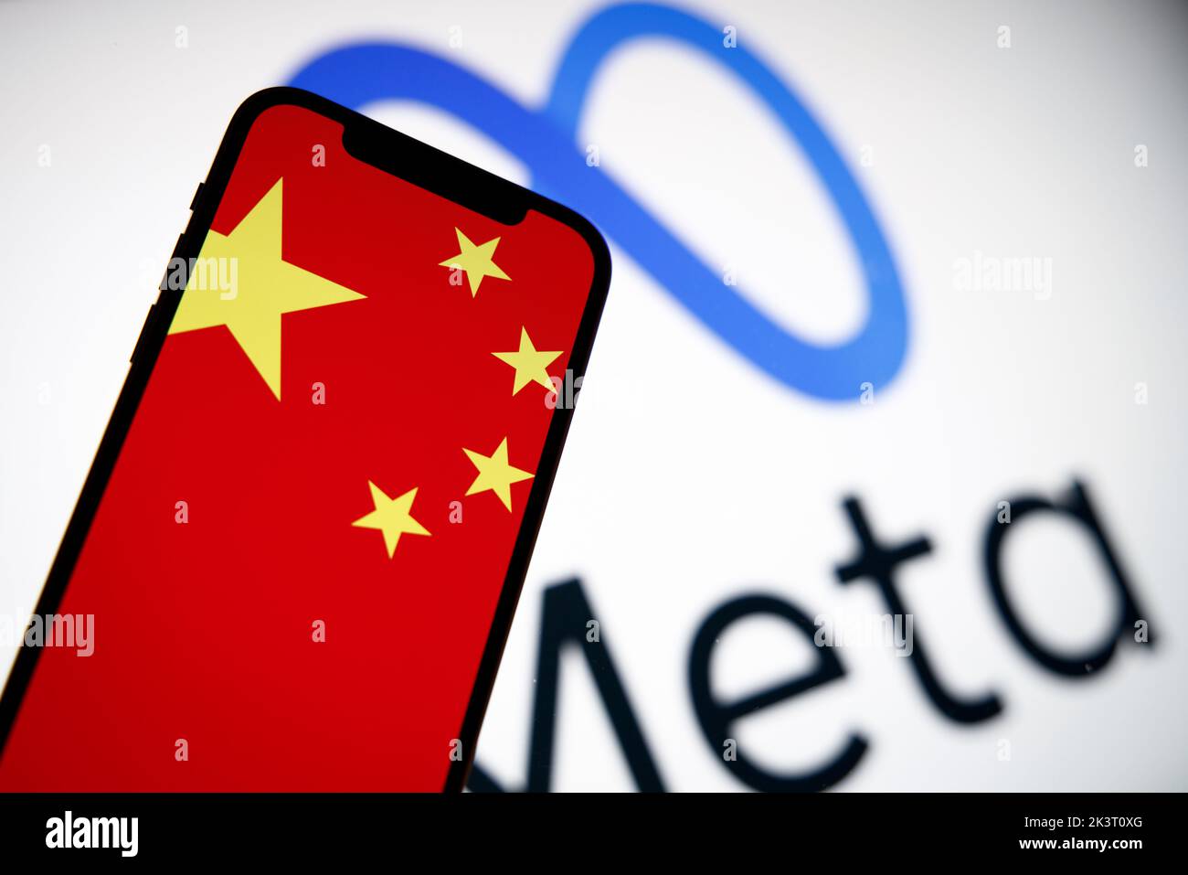 The Chinese flag is seen on a mobile phone with the Meta logo in the ...