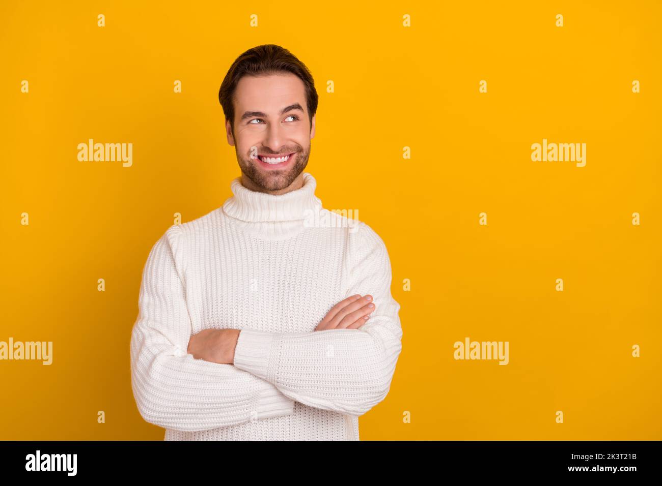 Photo of thoughtful pretty guy dressed white sweater arms crossed ...