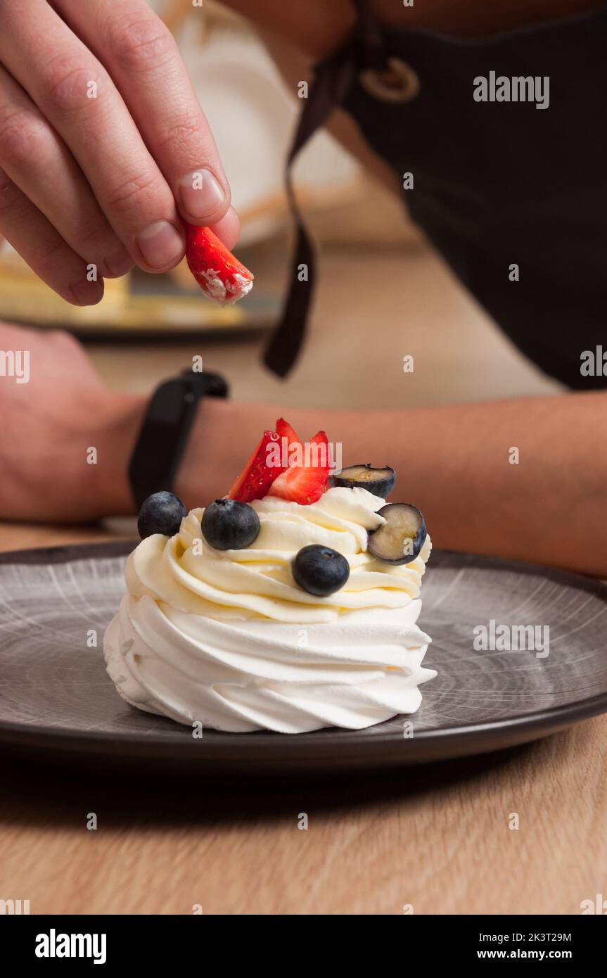Female pastry chef prepares cake hi-res stock photography and images ...