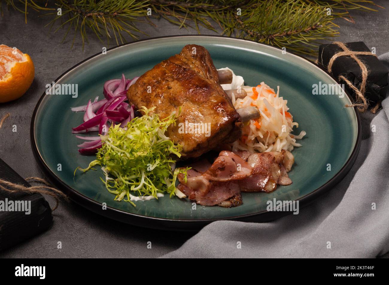tasty ribs with bacon and cabbage and red onion Stock Photo - Alamy