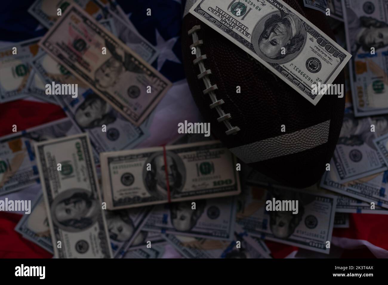 Money and rugby ball on american flag background, closeup. Concept of ...