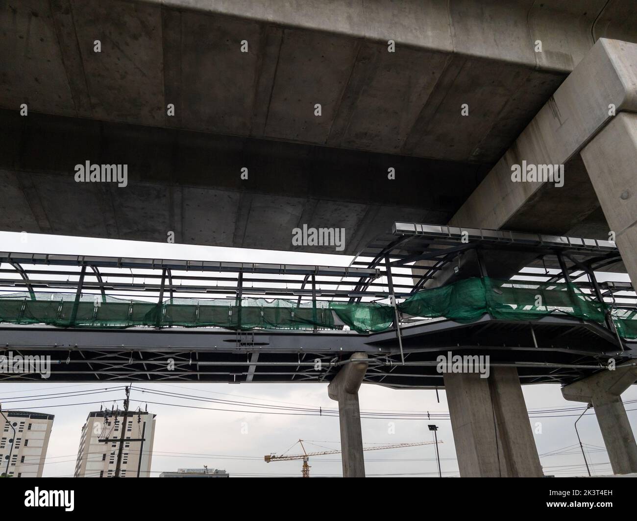 The construction site of the pedestrian overpass along the concrete ...