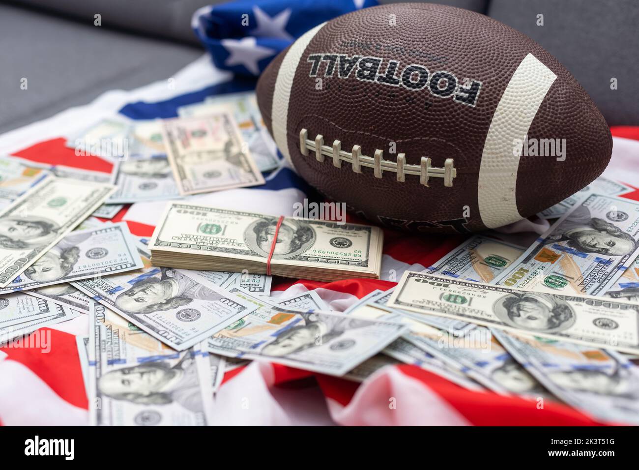 Money and rugby ball on american flag background, closeup. Concept of ...