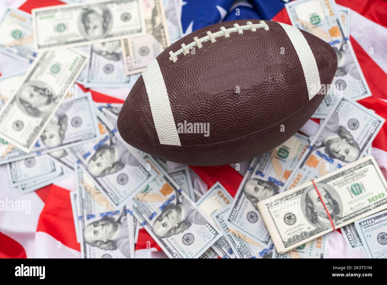 Money and rugby ball on american flag background, closeup. Concept of ...