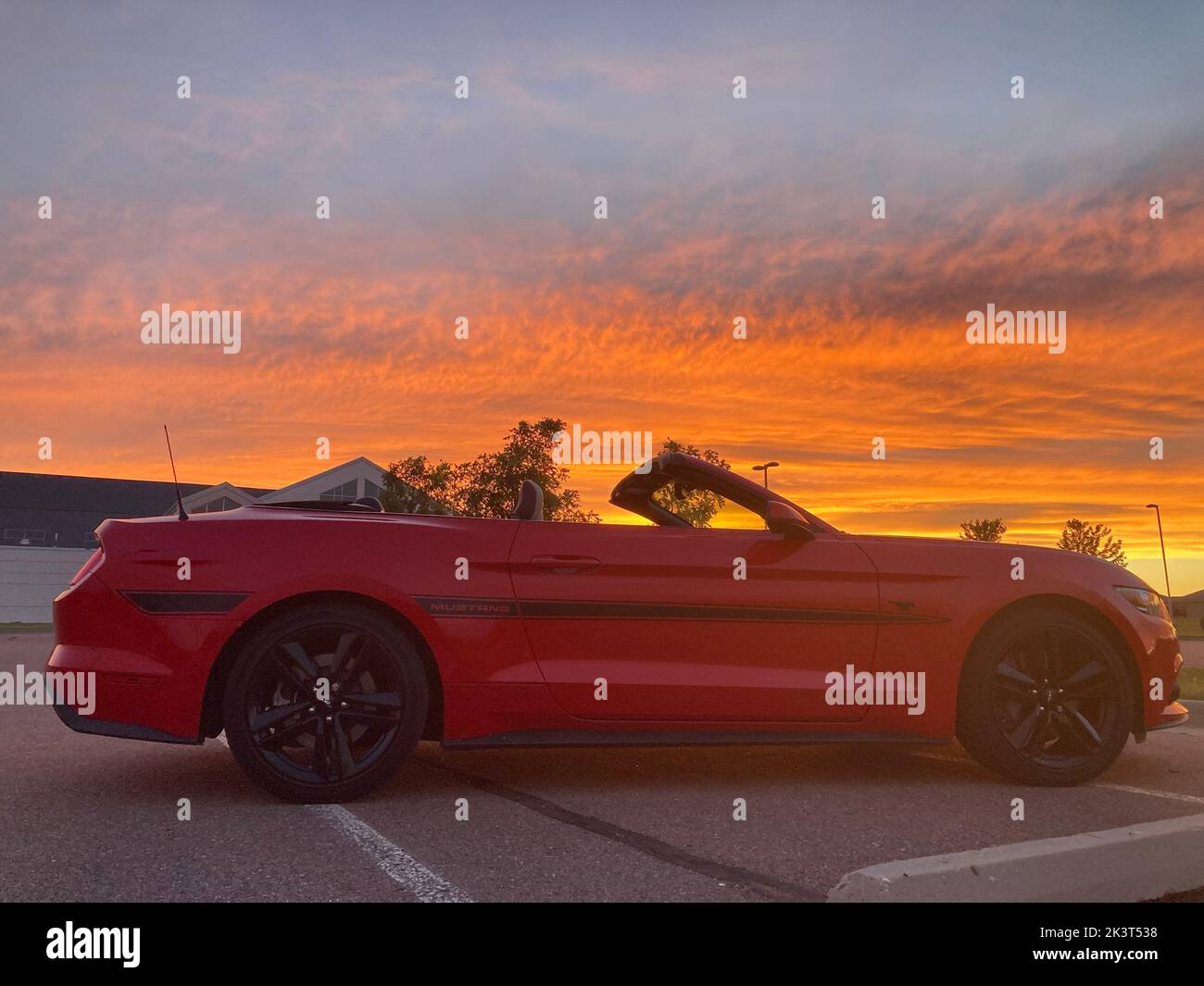A 2015 Ford Mustang at sunset with a very colorful sky Stock Photo - Alamy