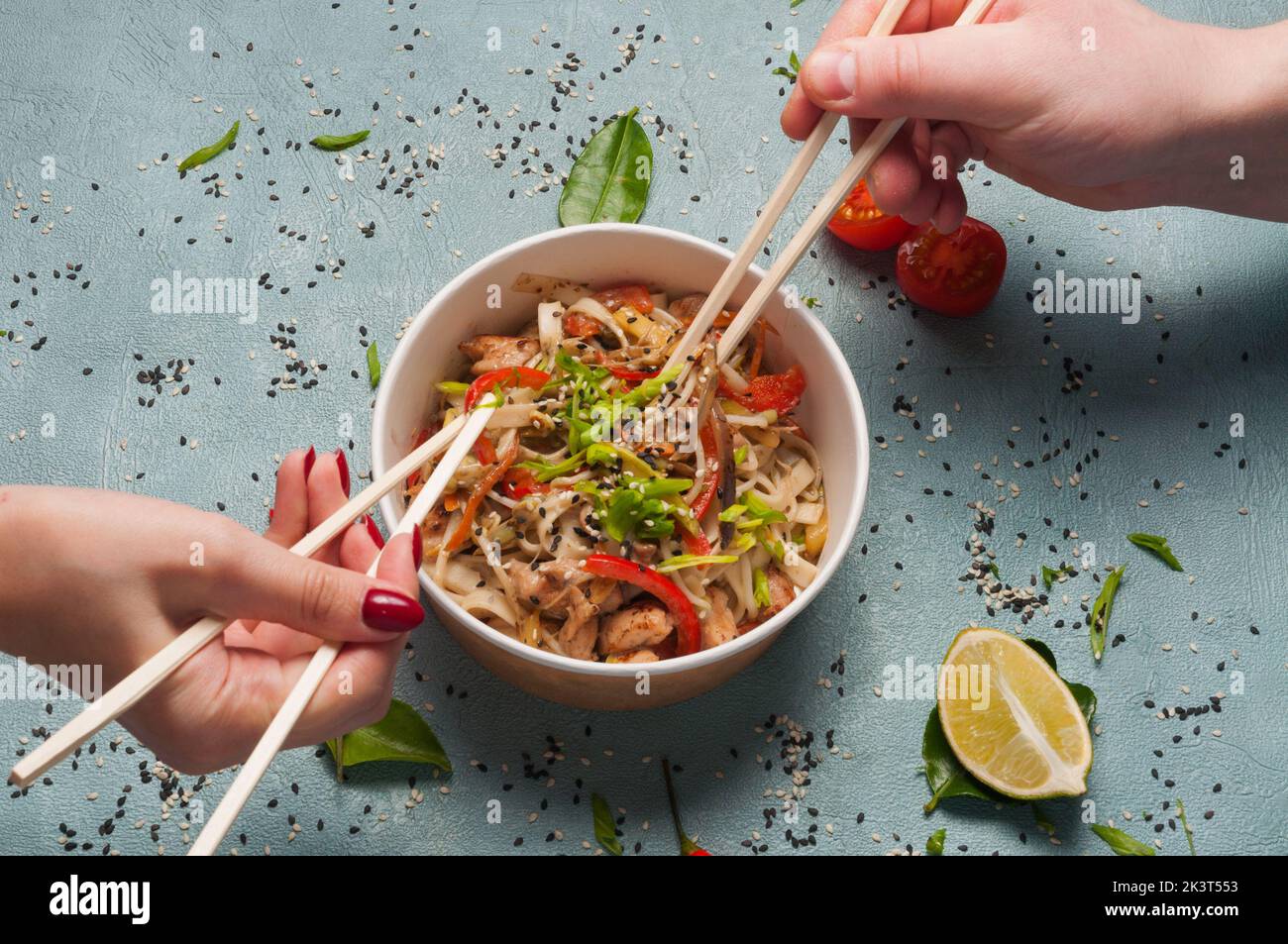 Chinese girl eating spaghetti hi-res stock photography and images - Alamy