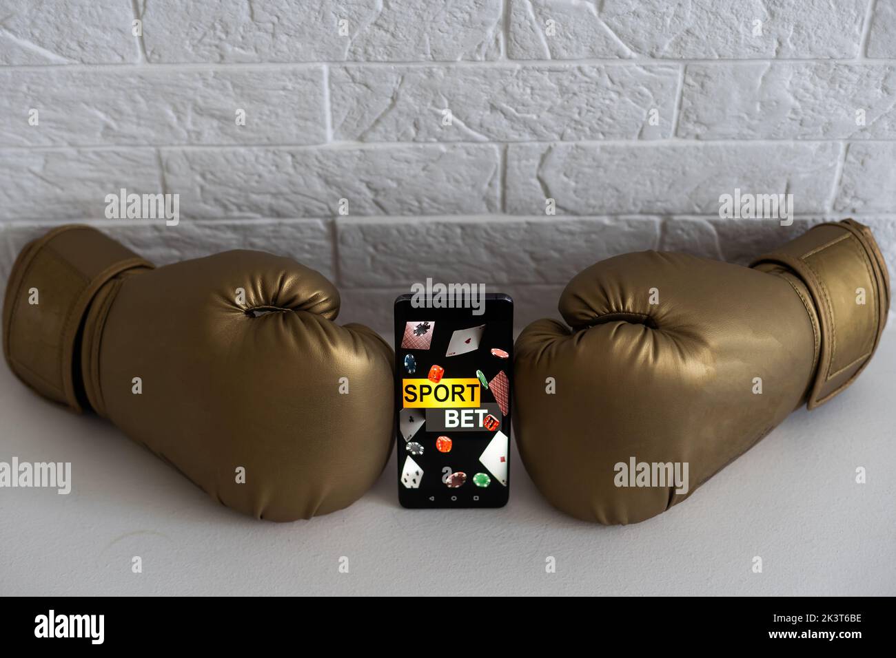 boxing gloves and smartphone with bets Stock Photo - Alamy