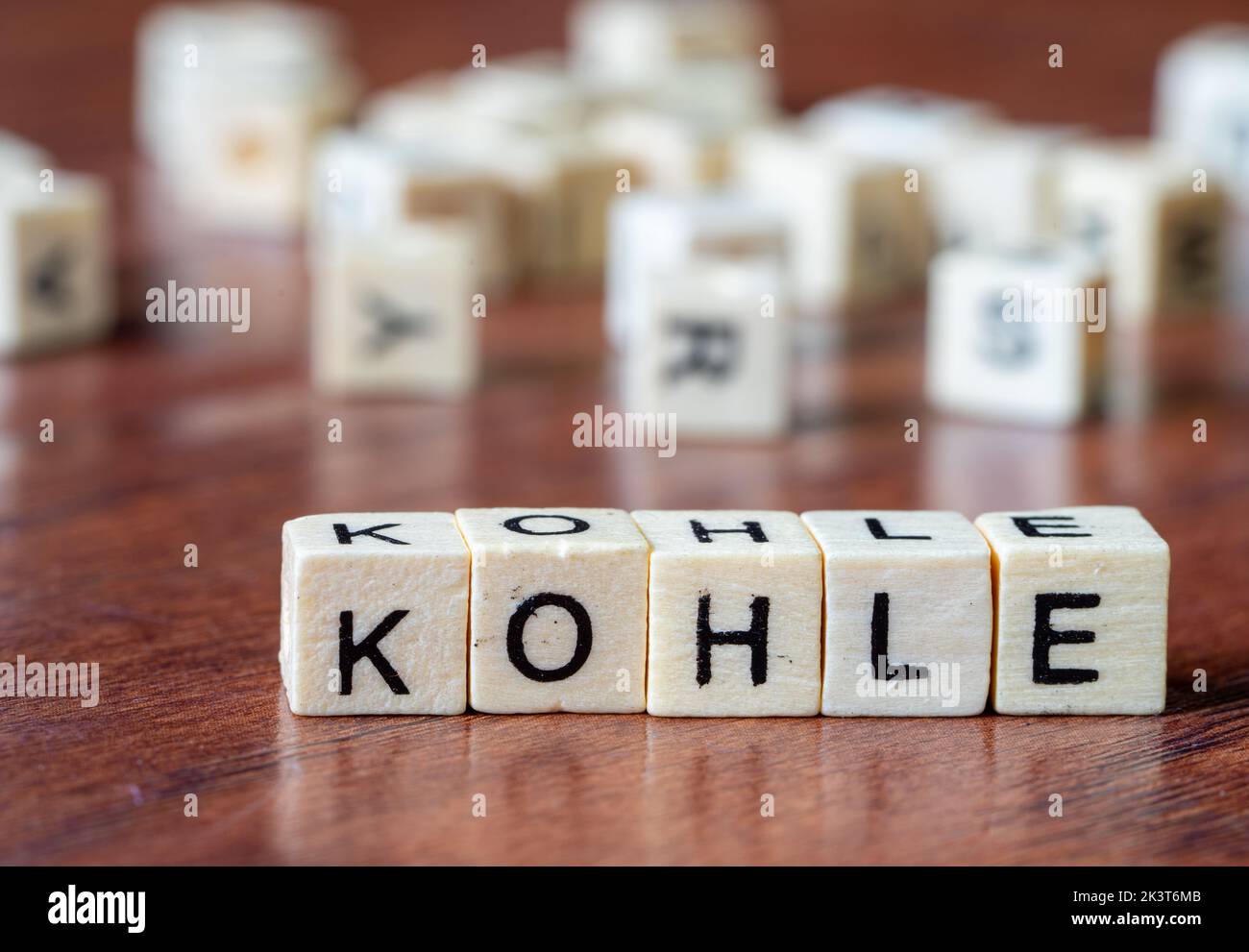 The word coal isolated on a wood background Stock Photo - Alamy