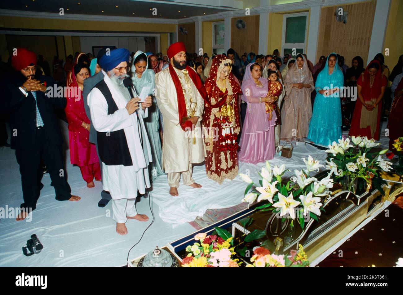 Sikh Wedding Priest Saying Prayers At Wedding In Central Gurdwara ...