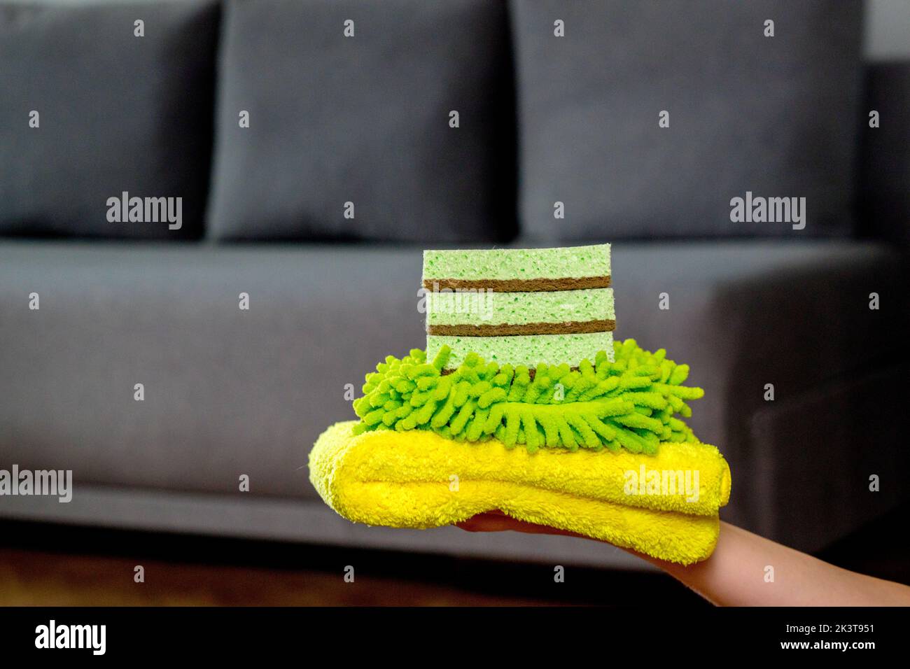 Colored rags and washcloths for manual cleaning on a woman's hand ...