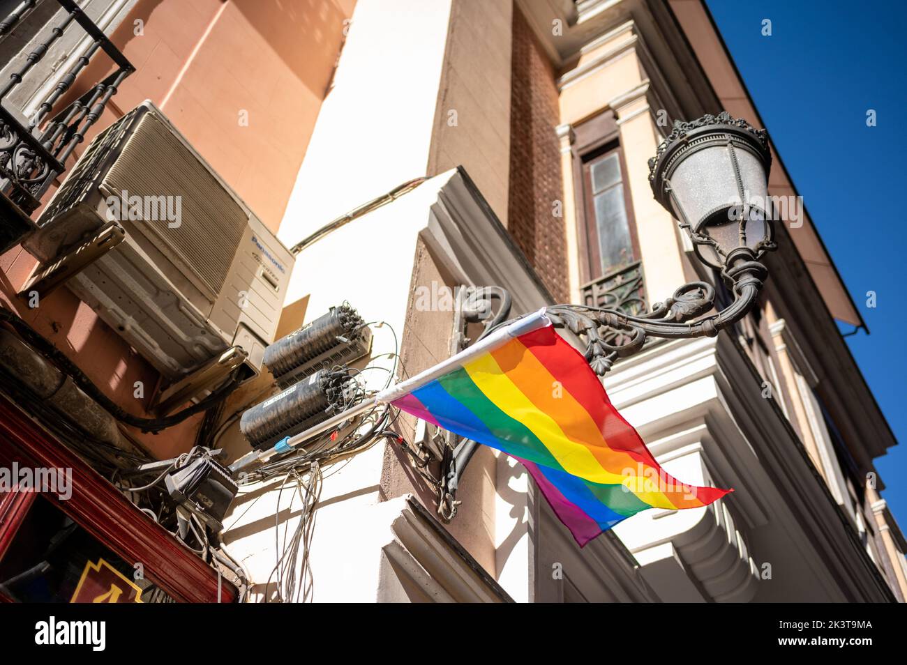 A low angle shot of a pride flag on a building facade Stock Photo - Alamy