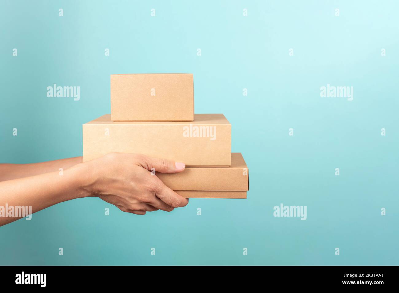 Hands holding present stack hi-res stock photography and images - Alamy