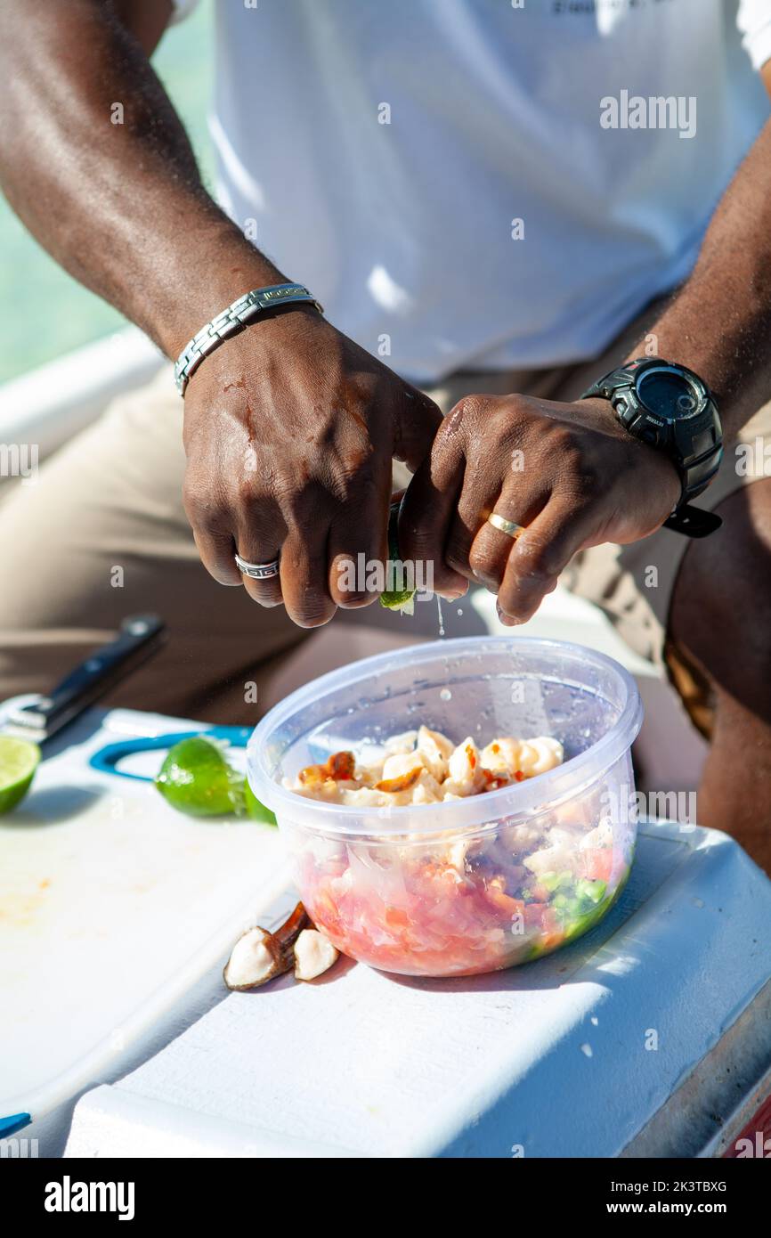 Bahamas food hands hi-res stock photography and images - Alamy