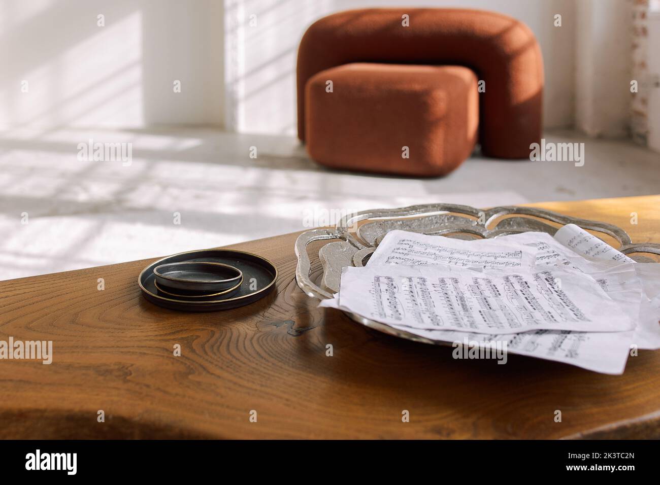 Modern room interior in minimal style. Music notes pages scattered on ...