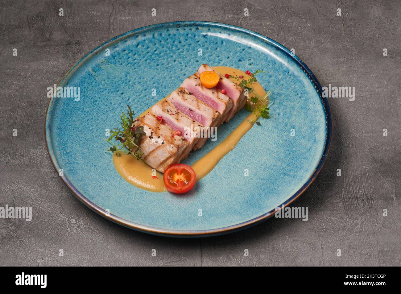 tasty grilled tuna sliced into pieces with mango sauce Stock Photo - Alamy