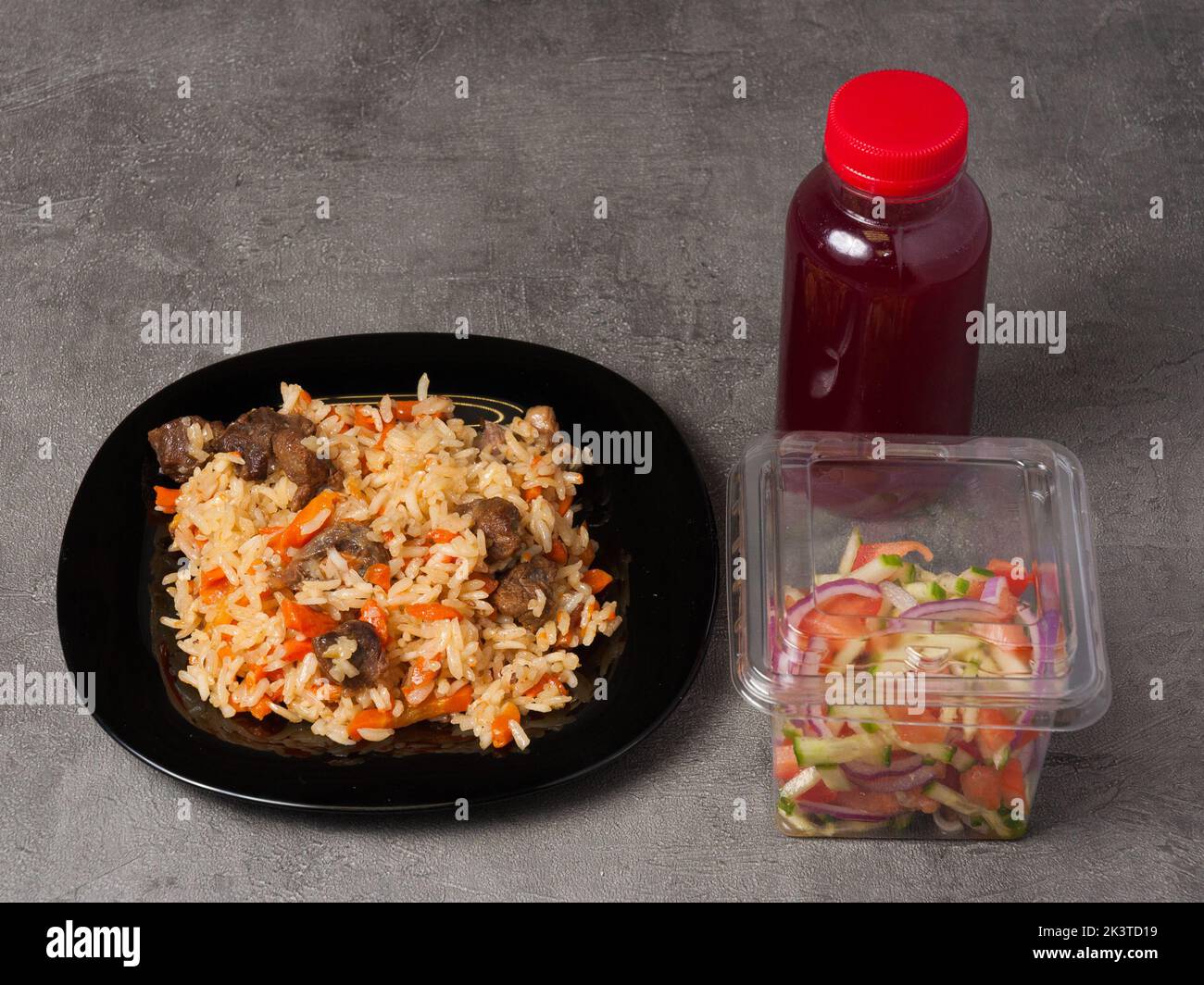 tasty Uzbek pilaf, vegetable salad and drink. lunch set Stock Photo - Alamy