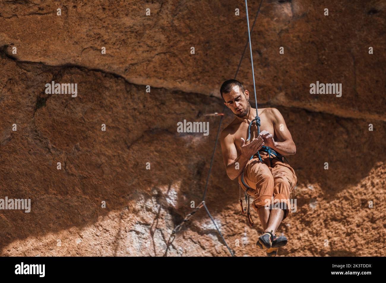 Hanging cliff hand hi-res stock photography and images - Alamy