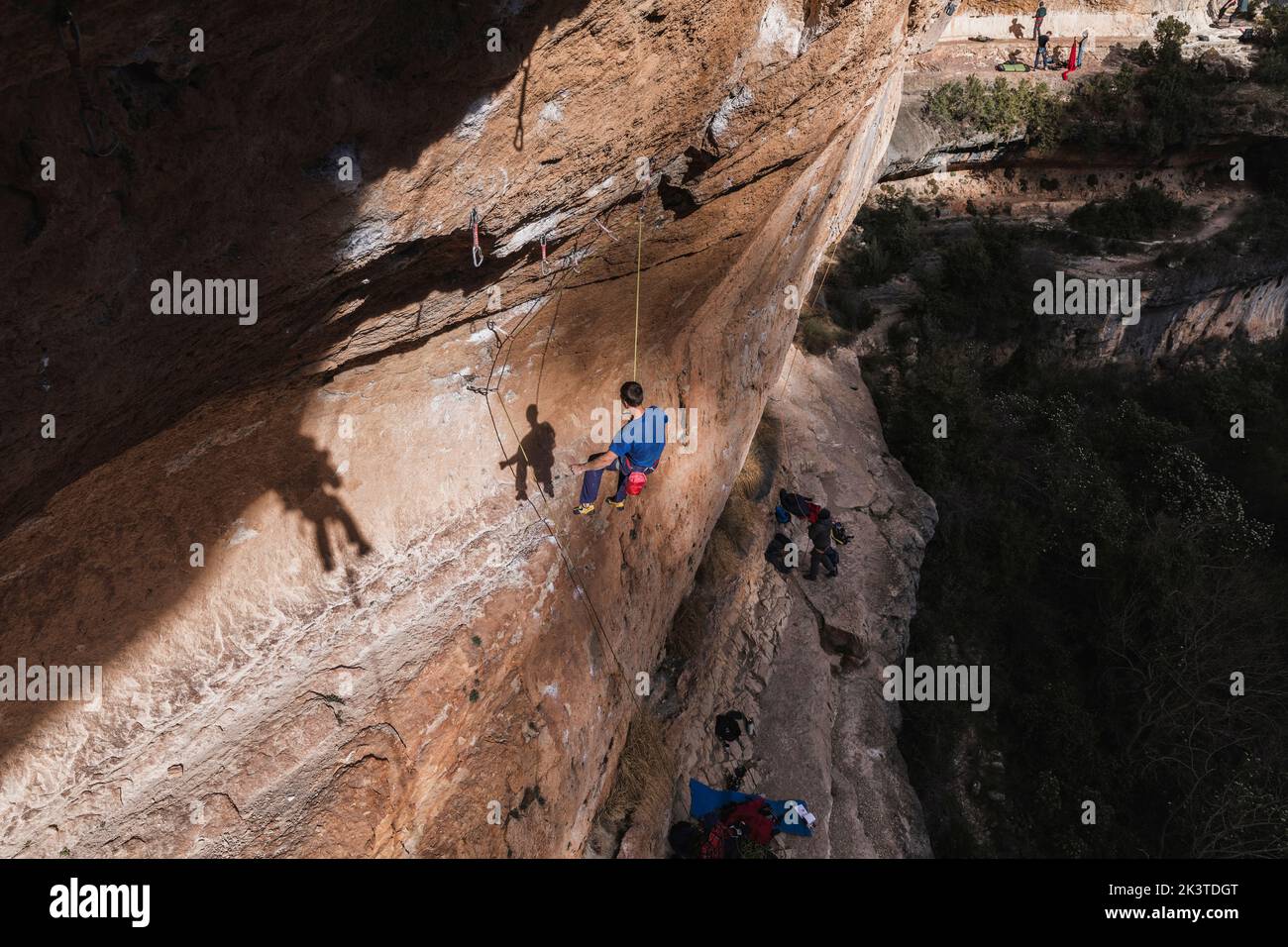 from above view of climber hanging on rope on rough cliff Stock Photo ...