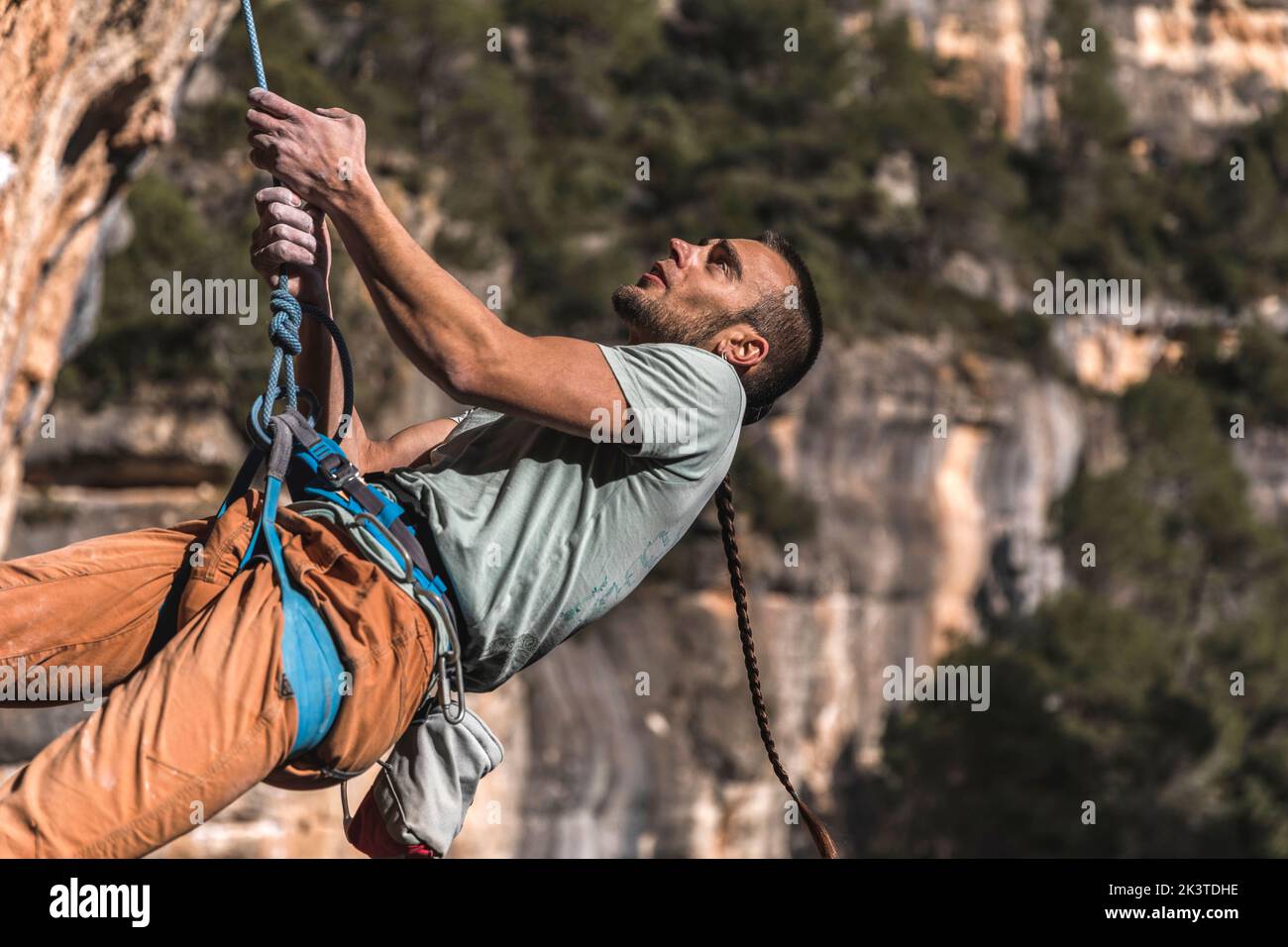 Hanging cliff hand hi-res stock photography and images - Alamy
