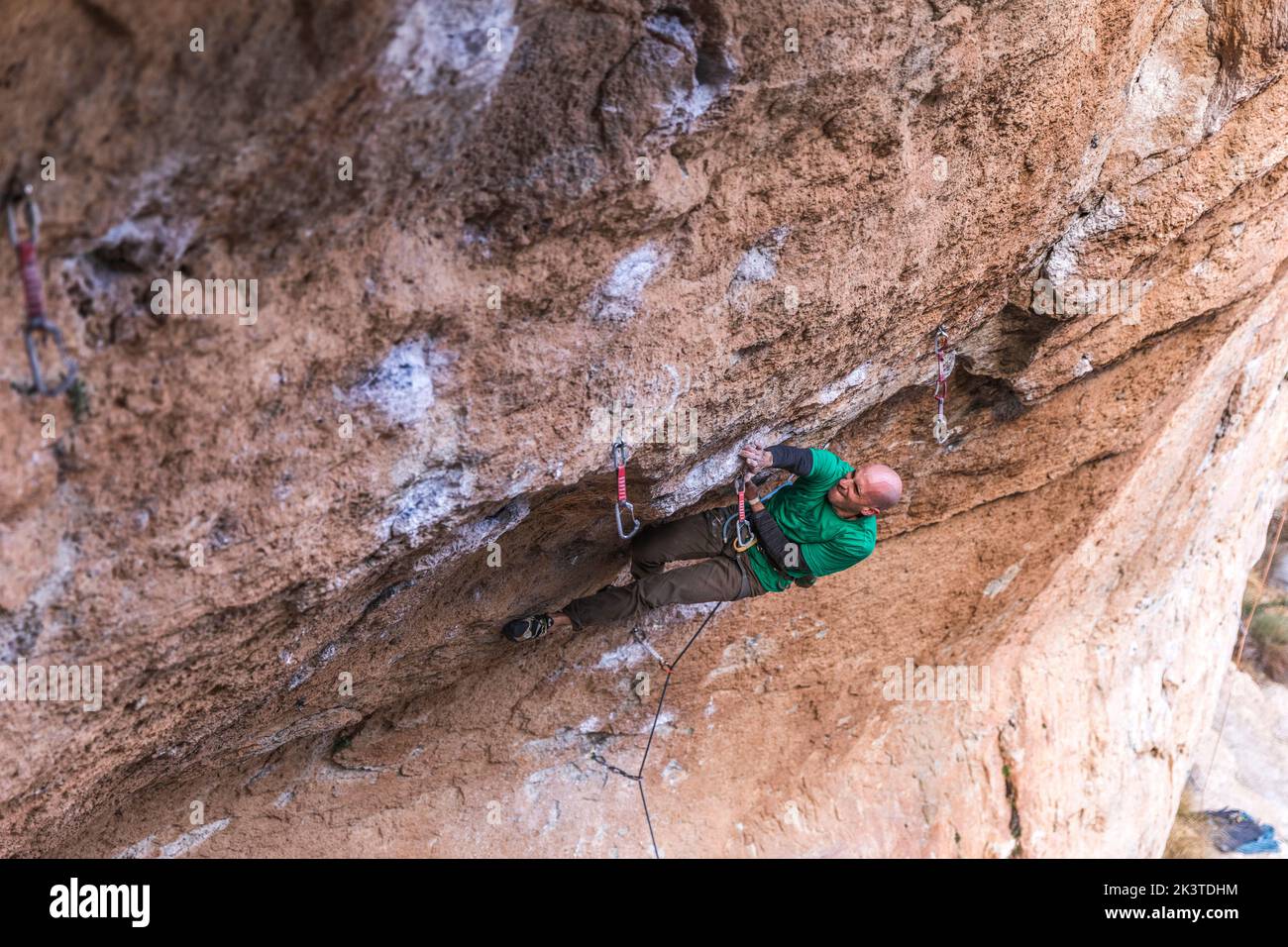 climber hanging on rope on rough cliff Stock Photo - Alamy