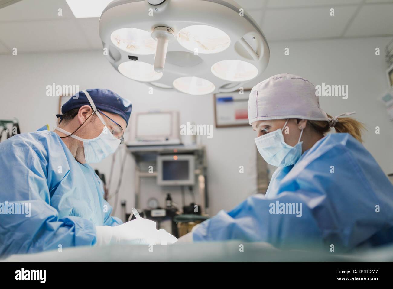 Doctors in uniforms preparing for operation in surgery Stock Photo - Alamy