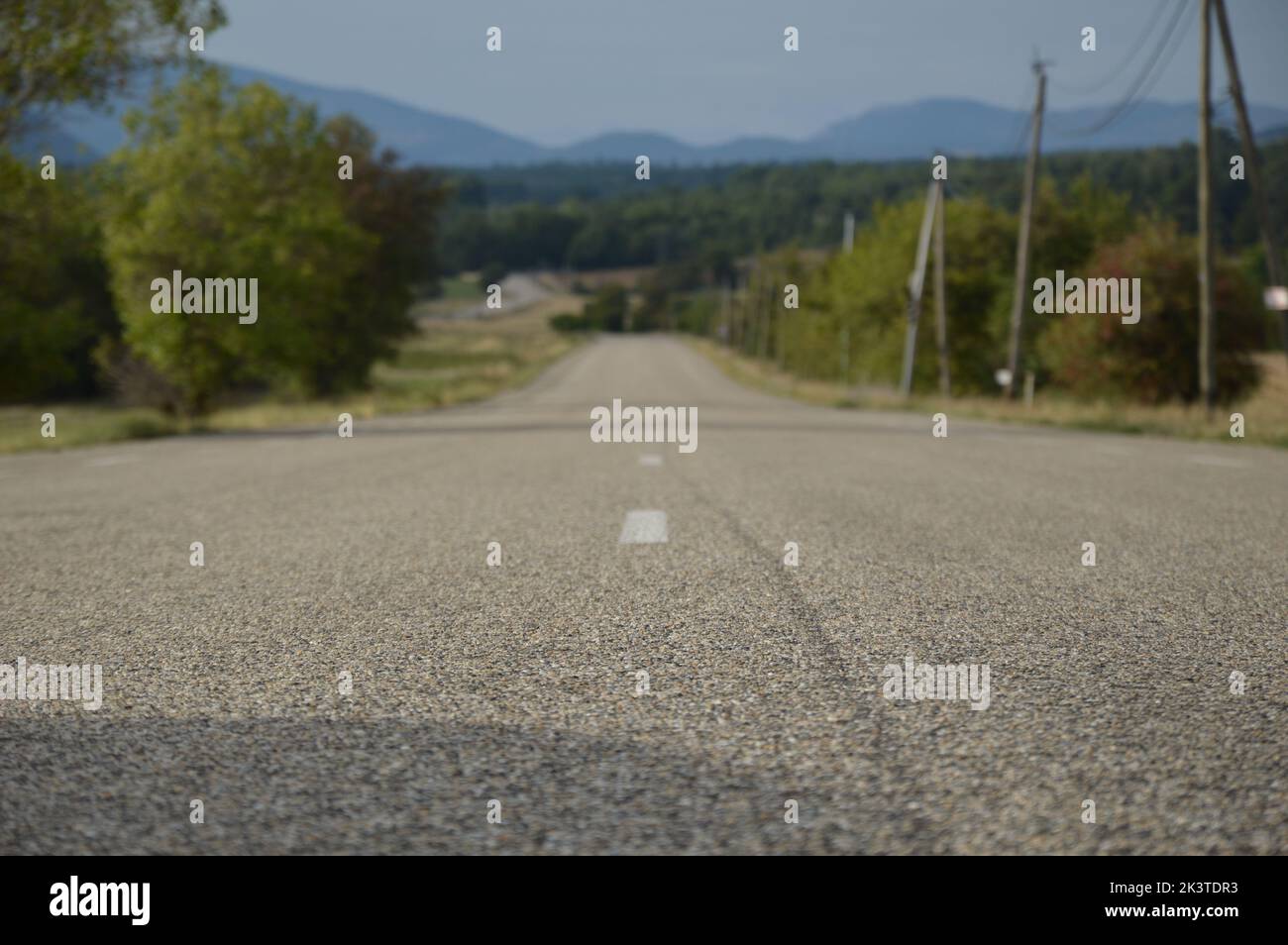 Long asphalt road in the countryside, France Stock Photo - Alamy