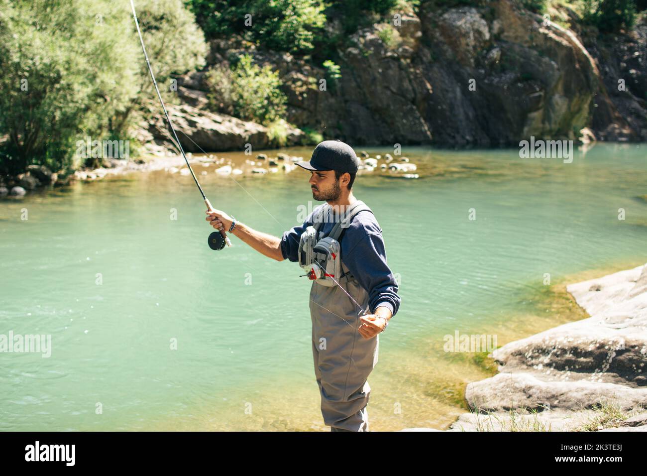 Throwing fishing rod hi-res stock photography and images - Alamy
