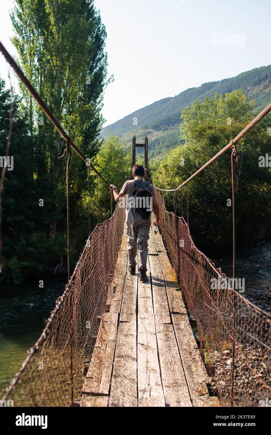 Young adventurous man crossing bridge hi-res stock photography and ...