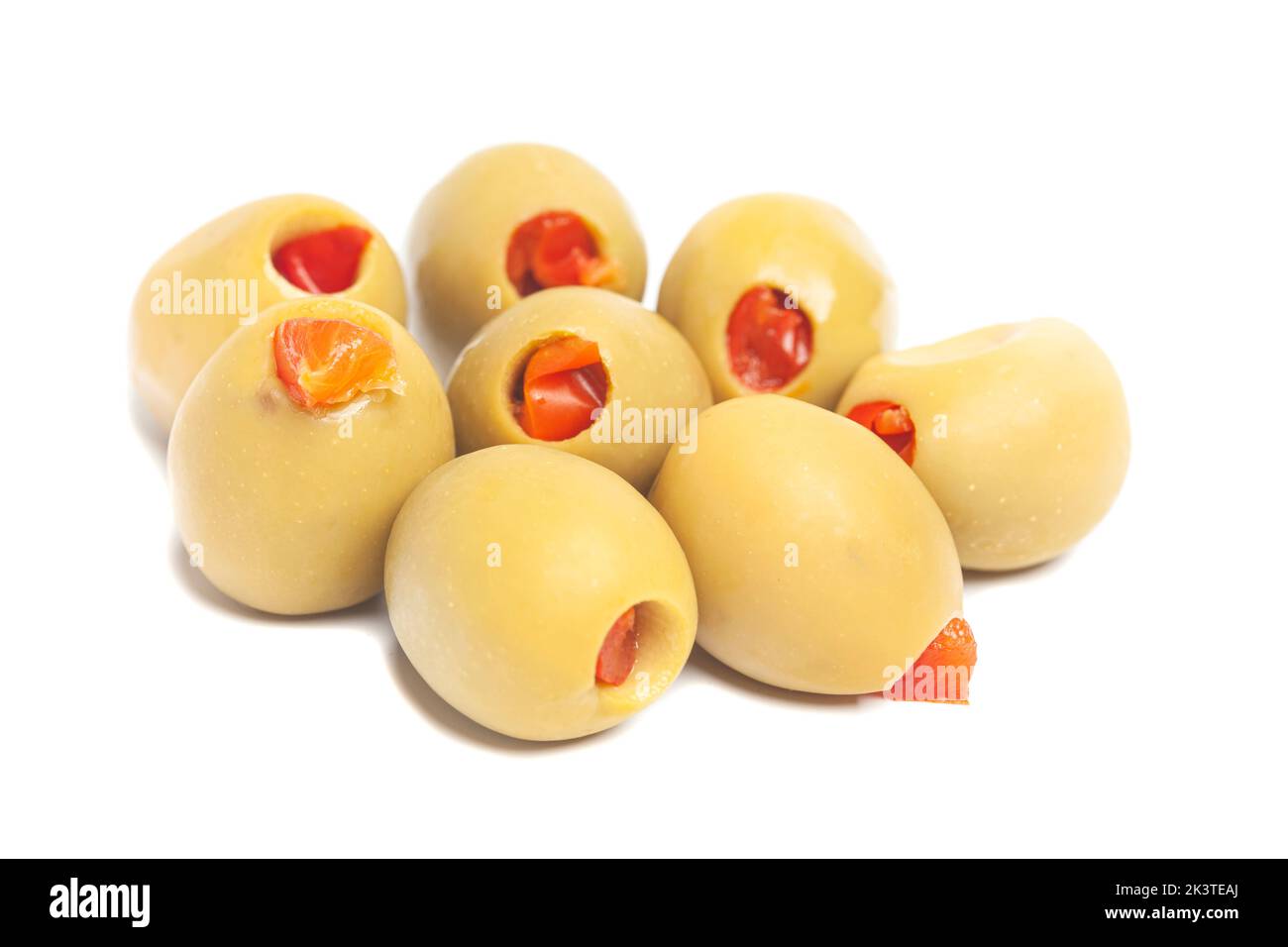 Green olives stuffed with sweet peppers isolated on a white background ...