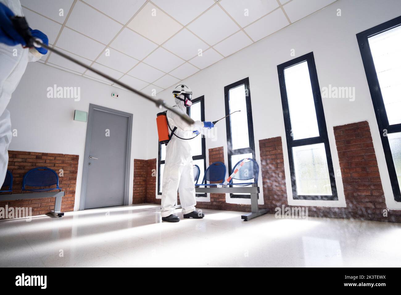 One firefighter disinfecting the interior of a building Stock Photo - Alamy
