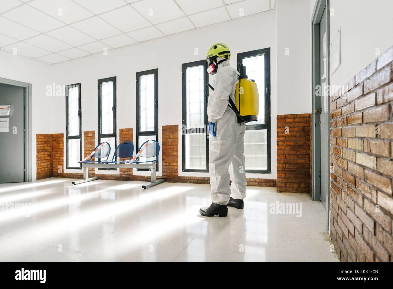 One firefighter disinfecting the interior of a building Stock Photo - Alamy