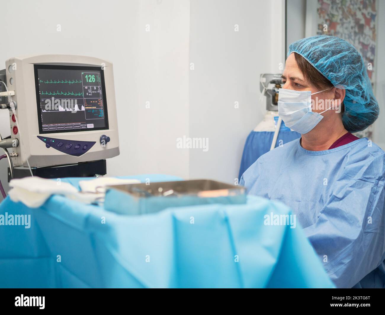 Professional woman doctor in medical uniform examining modern vital ...