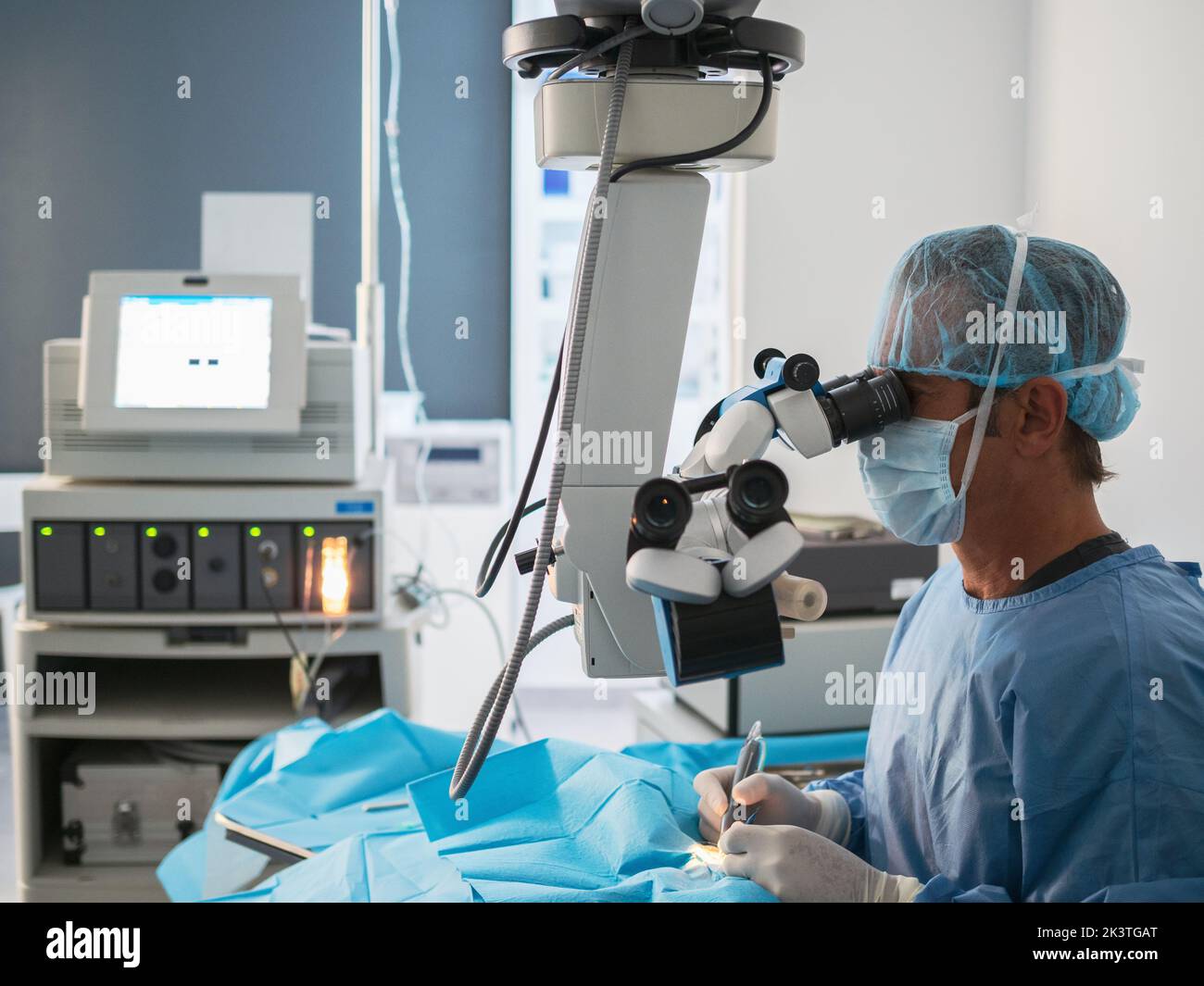 Side view of adult doctor in medical uniform using professional ...
