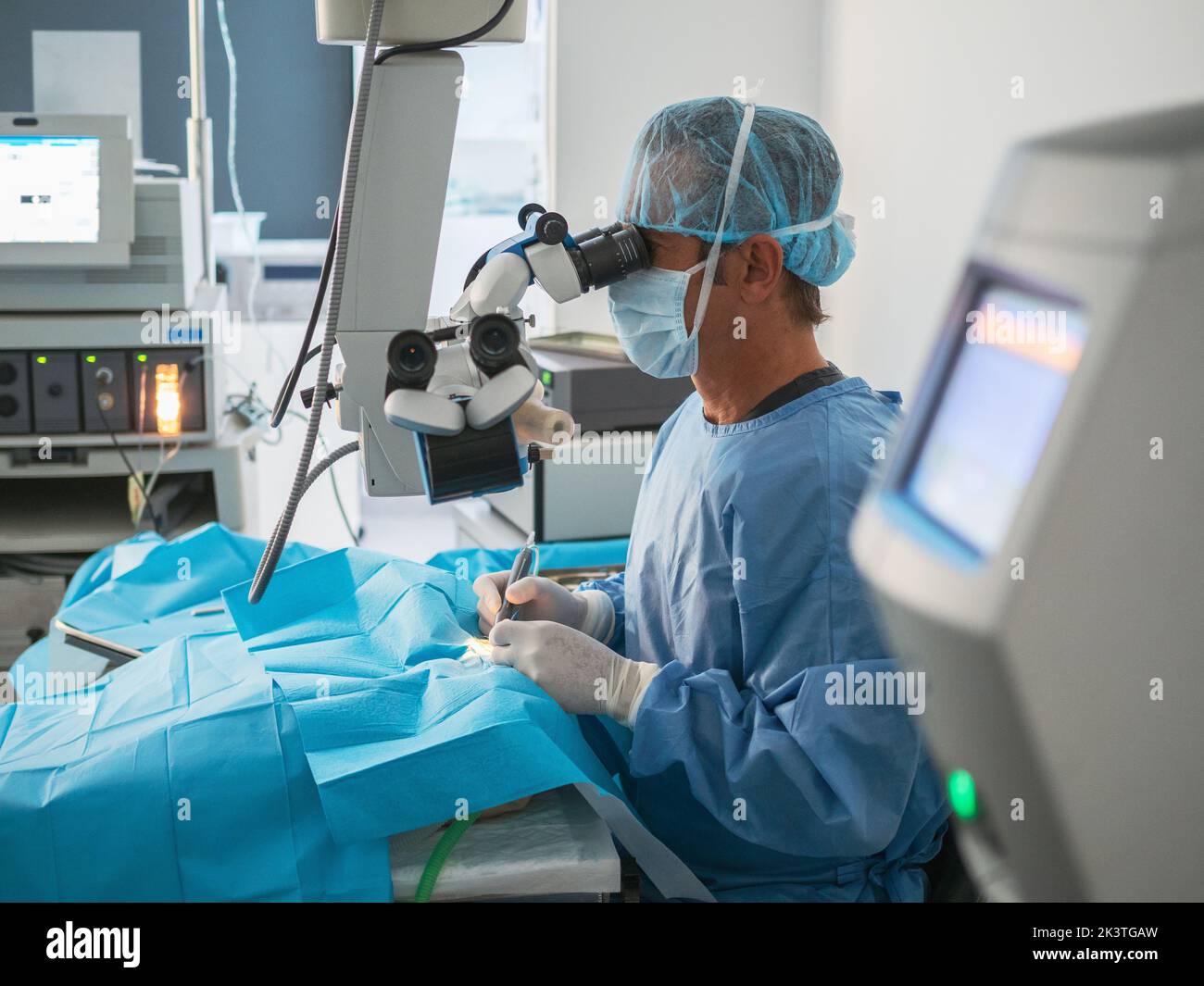 Side view of adult doctor in medical uniform using professional ...
