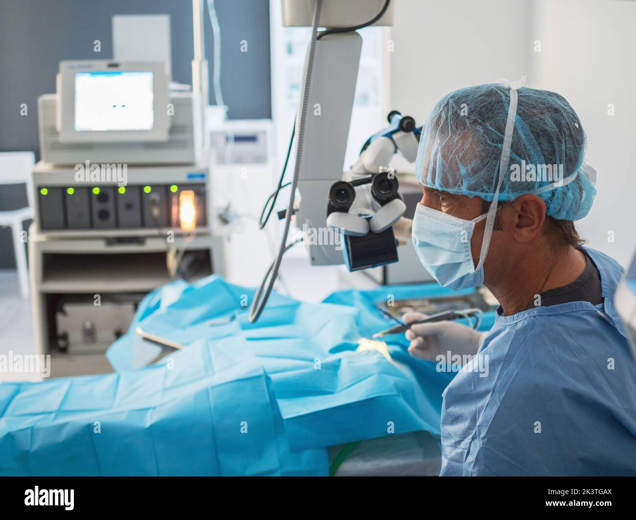 Side view of adult doctor in medical uniform using professional ...