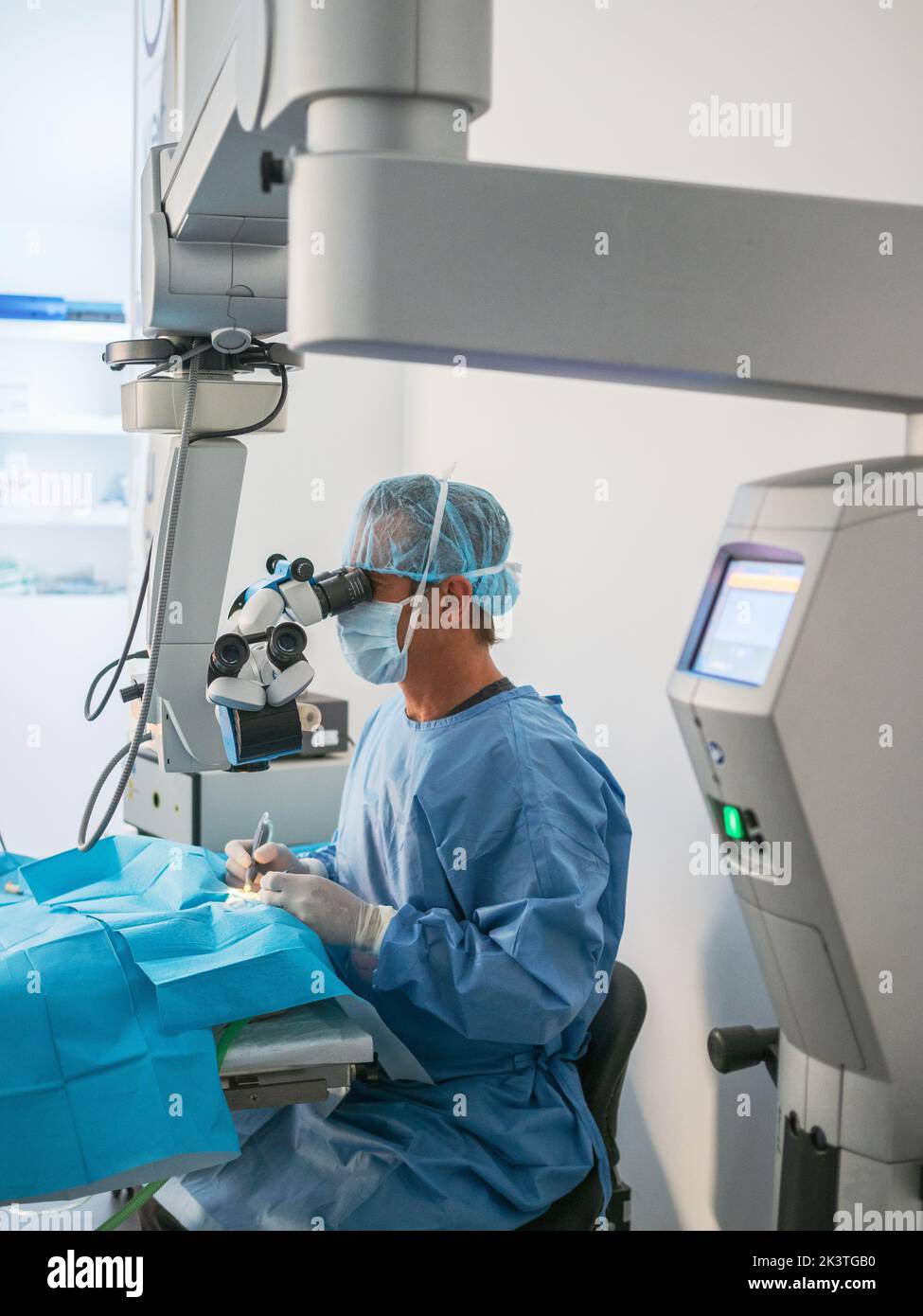 Side view of adult doctor in medical uniform using professional ...