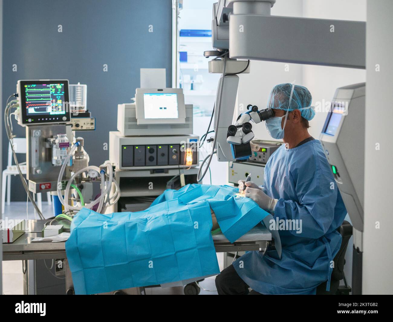 Side view of adult doctor in medical uniform using professional ...