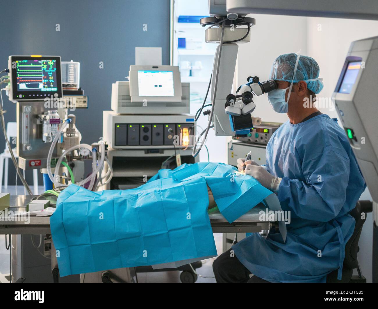 Side view of adult doctor in medical uniform using professional ...