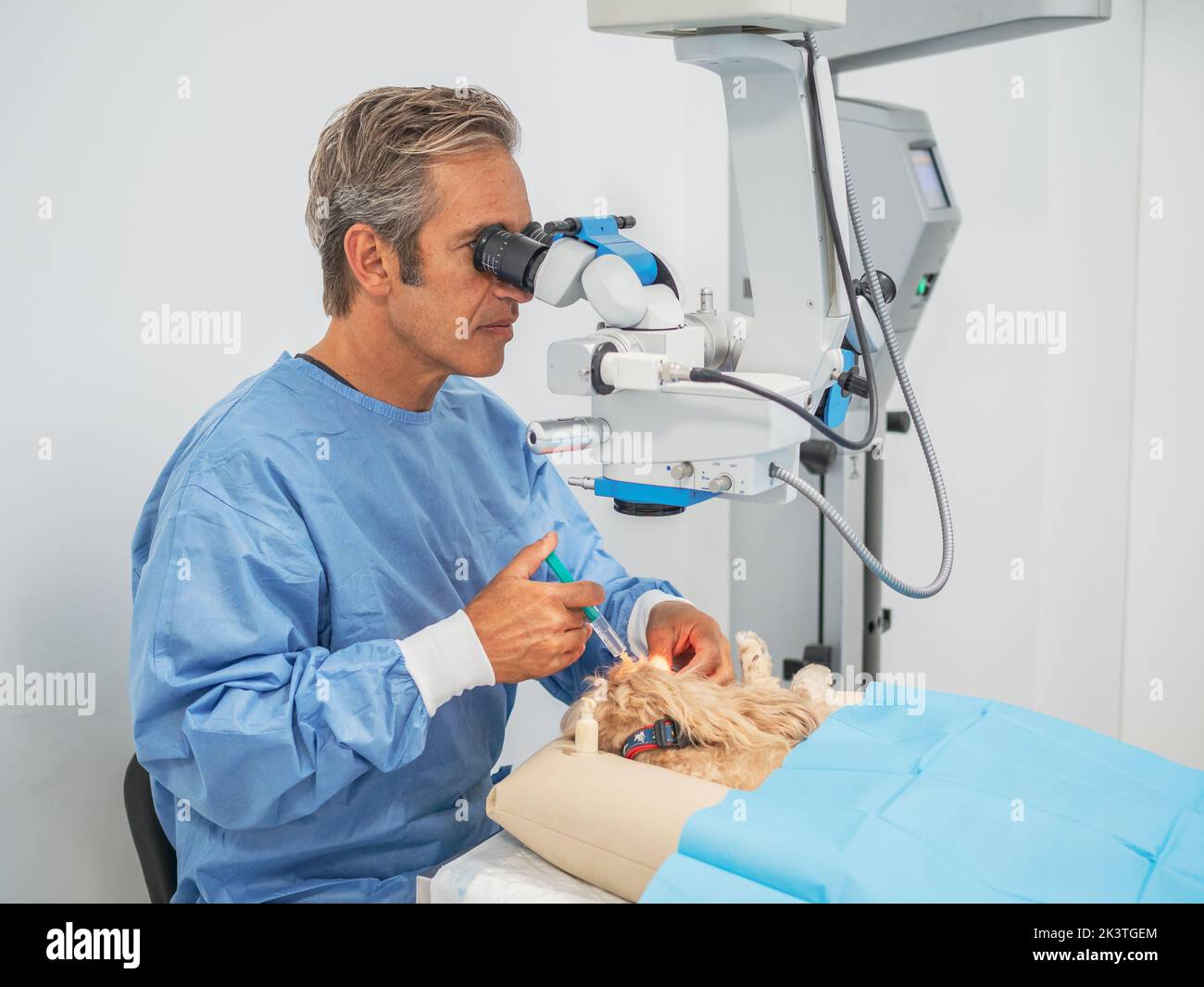 Adult man in medical uniform using goggles to examining and preparing ...
