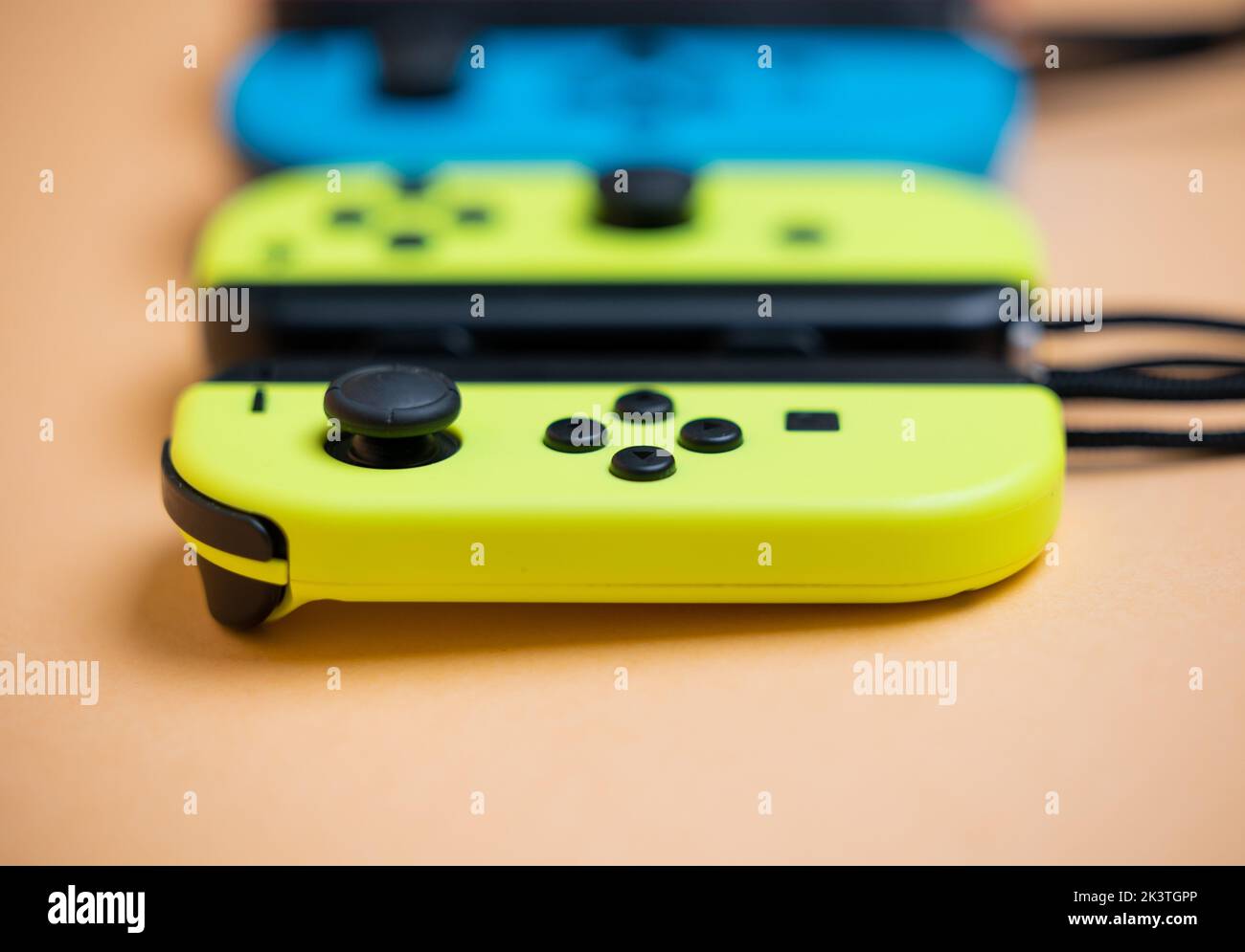 Nintendo Switch Joy-Cons aligned in a row. Yellow blue and red Joy-Cons ...