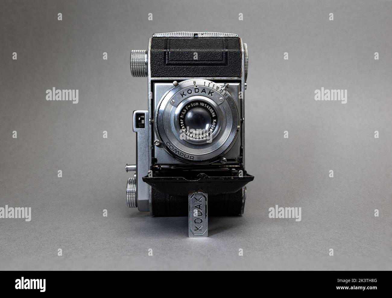 Vintage Camera on grey background. Oldschool analog camera Stock Photo ...