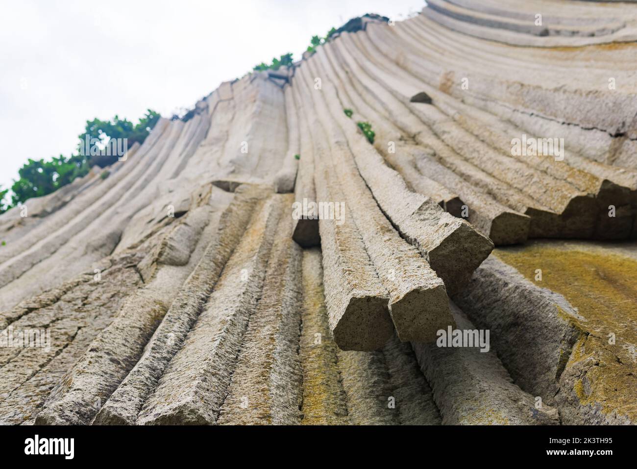basalt columns forming a coastal rock at Cape Stolbchaty on Kunashir ...