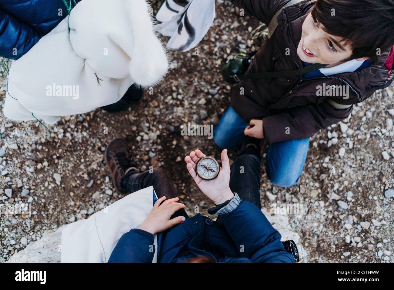 group of children holding a compass Stock Photo - Alamy