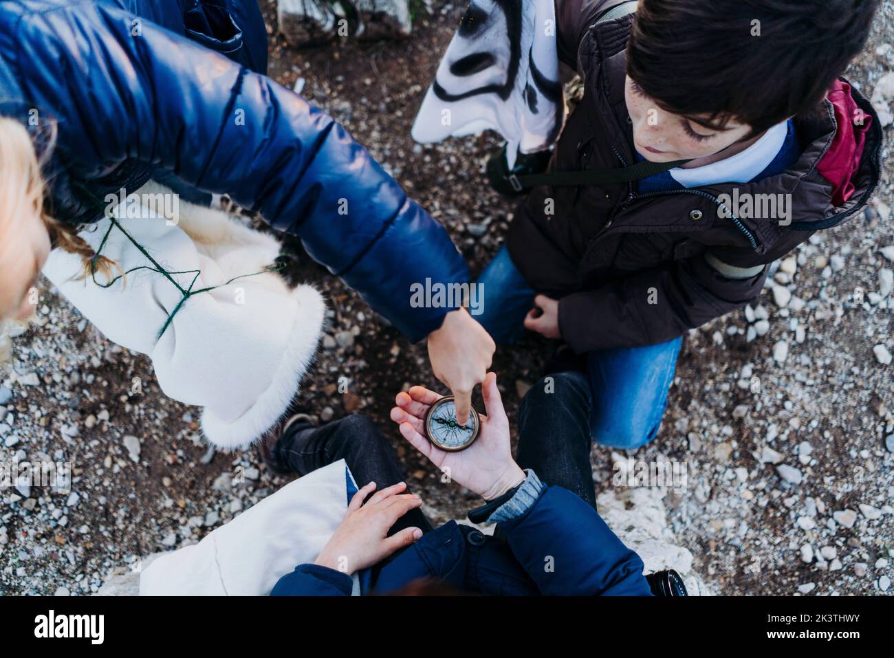 group of children holding a compass Stock Photo - Alamy