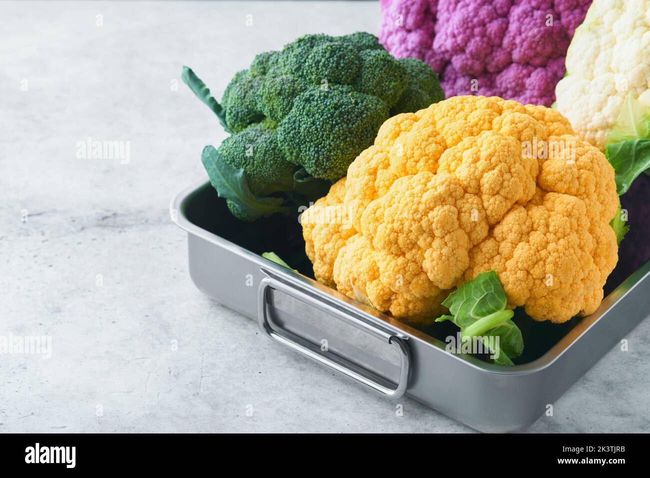 Colorfu cauliflower. Various sort of cauliflower on gray concrete ...