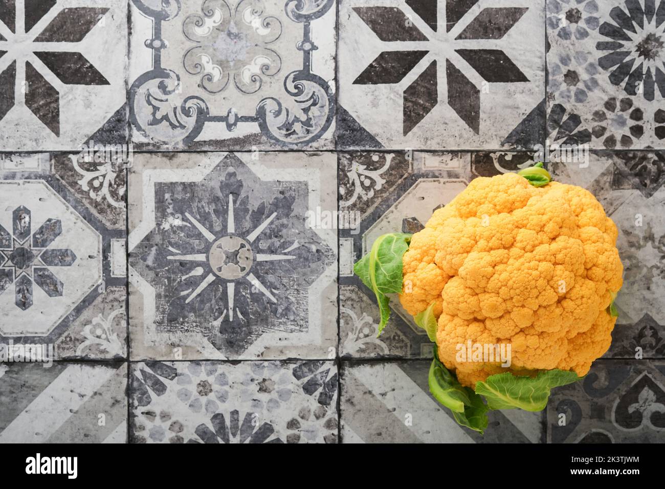 Colorfu cauliflower. Various sort of cauliflower on stone tiles gray ...