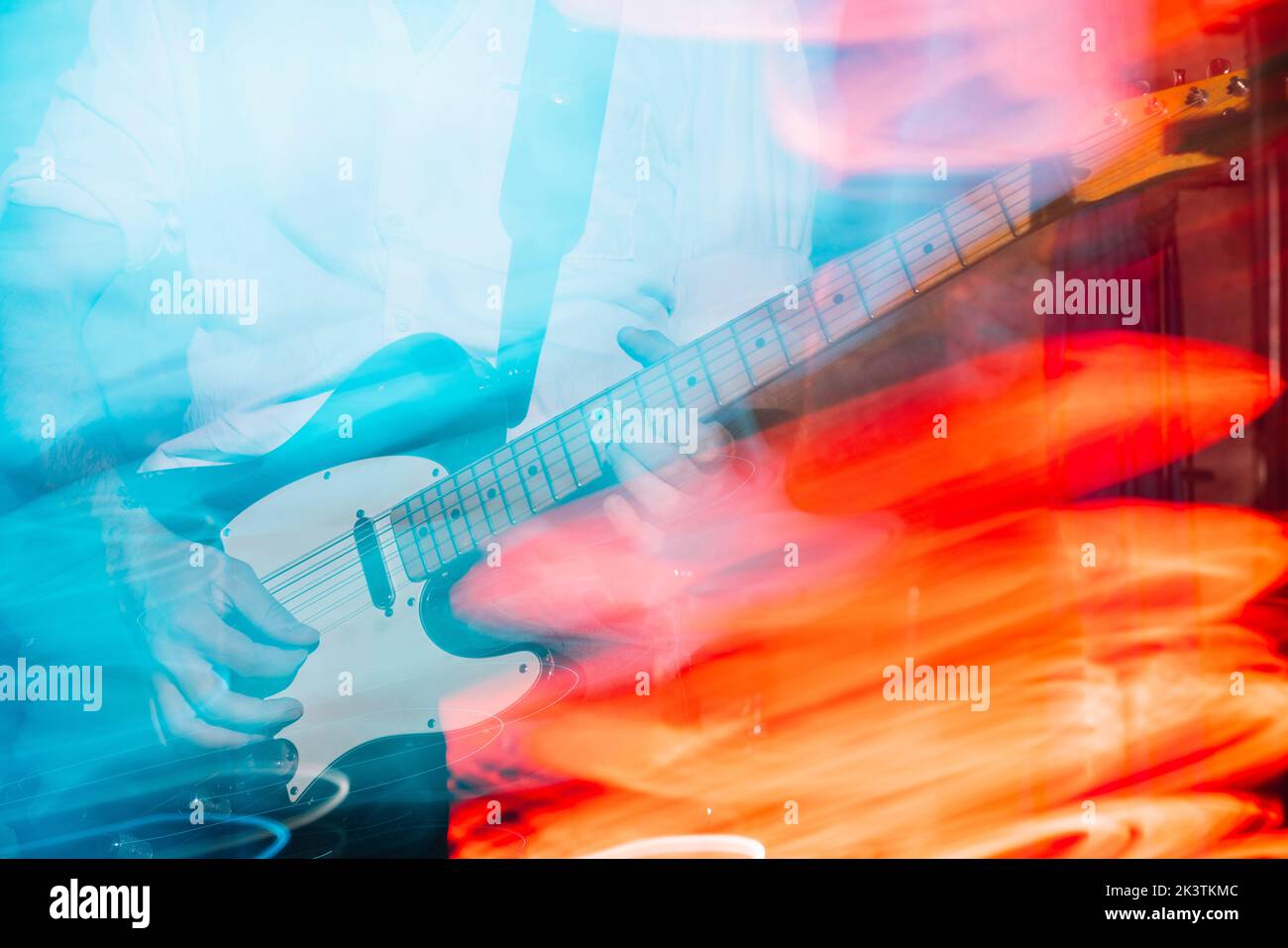 Blurred scene of guitar player playing an electric guitar on stage Stock Photo - Alamy