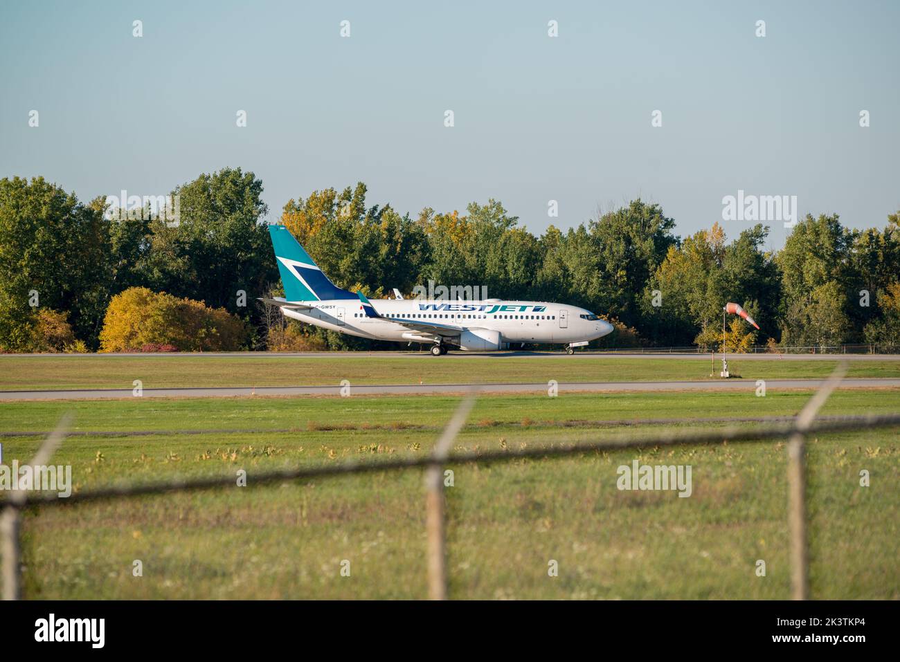 A Westjet commercial jet aircraft taxiing at the Ottawa McDonald ...